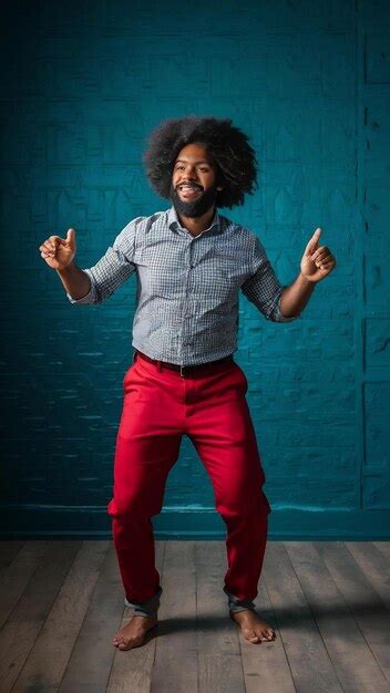 Full Length Portrait Of Glad African Guy In Red Pants Fooling Around