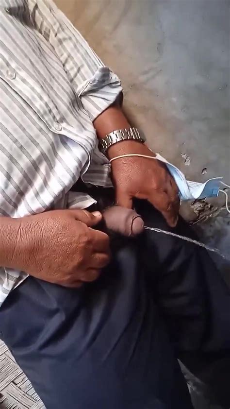 Mature Latino Man Pissing In Trough Urinal