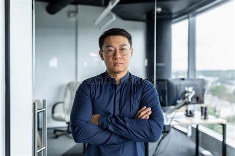 Portrait Of Serious Asian Developer Businessman With Crossed Arms