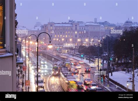 Evening Traffic In Vienna Streets With Snow Falling Trams Cars