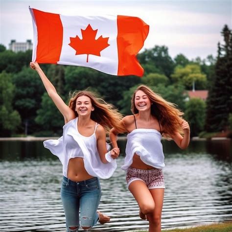 Premium Ai Image Happy Canada Day Two Girls Running With A Canadian Flag