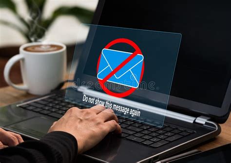 A Businesswoman Works On Her Laptop Computer With A Caution Box Shown On The Screen Spam E Mail