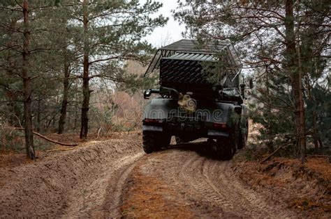 Multiple Launch Rocket System In Combat Conditions On The Battlefield