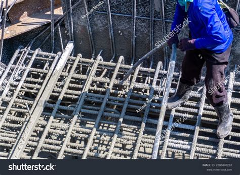 Construction Worker Useing Concrete Vibrator While Stock Photo Edit Now