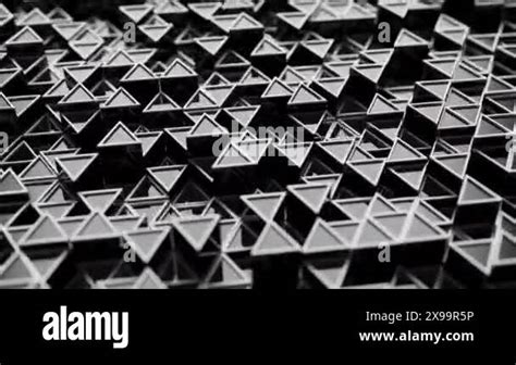 Looping Animation Of A Group Of Black Plastic Triangular Geometric