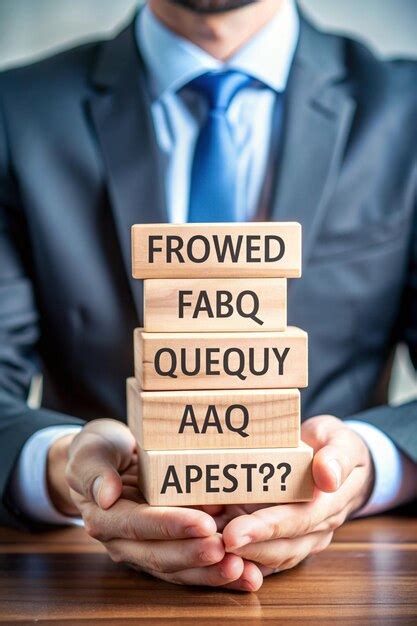 Businessman Puts Wooden Blocks With The Word Faq Frequently Asked