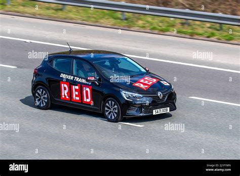 Red Learner Driver Training Black Renault Clio Iconic Tce 5 Speed