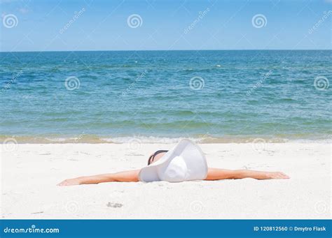 Tanned Beautiful Girl On The Beach On The Sands Stock Image
