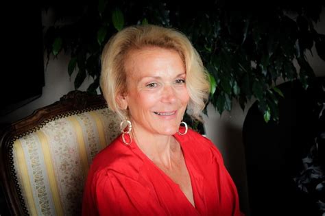 Premium Photo Smiling Woman Looking Away While Sitting At Home