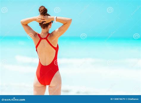 Young Woman In Red Swimsuit Standing On Seashore Stock Image Image Of