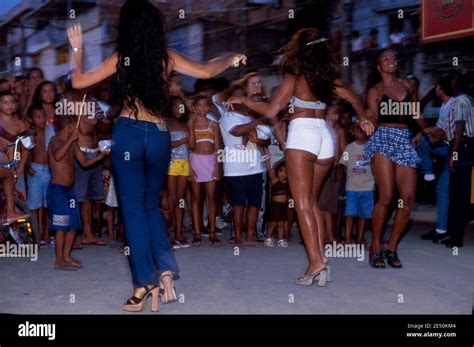Beuatiful Multi Ethnic Sensual Young Women Dancing Samba At Favela Da
