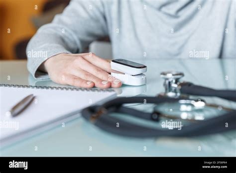 Female Patient Hand Measuring Oxygen Saturation And Pulse Using Portable Oximeter Health Care