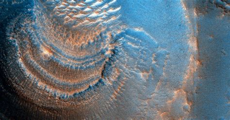 Orbiter Discovers Mysterious Shapes Inside Mars Craters