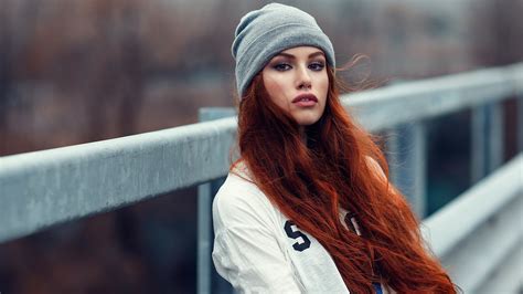 Redhead Girl Model Is Leaning Back On Fence Wearing White Dress And Ash