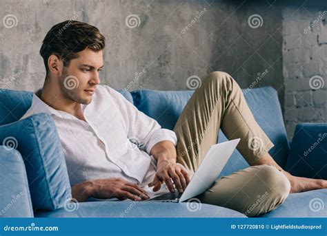 Man Typing On Laptop Keyboard While Lying Stock Photo Image Of Laptop Male 127720810