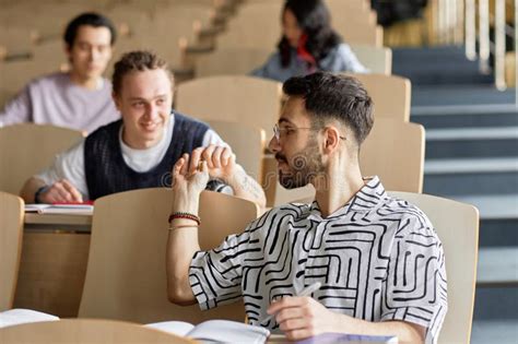 Male College Student Handing Note To Classmate Stock Image Image Of