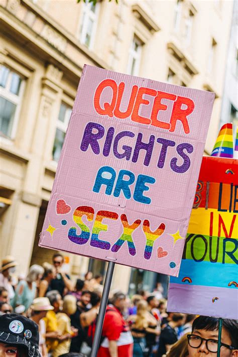A Group Of People Holding Signs In The Street Photo Free Stuttgart Image On Unsplash