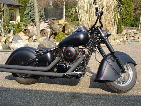 A Black Motorcycle Is Parked On The Street