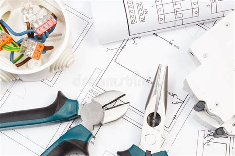 Tools Using For Works Electric Fuse And Box With Connected Colorful Cables And Diagrams Of Plan