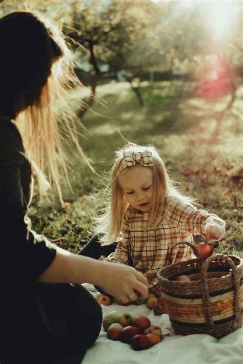 A Person And A Girl Sitting Outside Photo Free Human Image On Unsplash