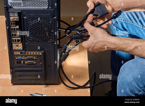 Man Holding Fixed Wires Guy Trying To Untangle The Wires Close Up Side View Cropped Photo