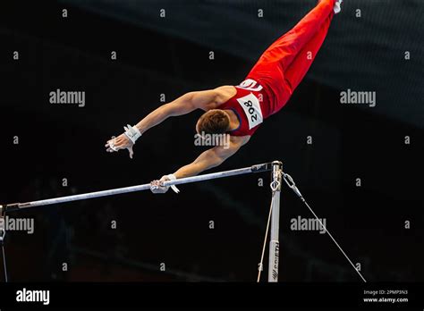 Athlete Gymnast Exercise On Horizontal Bar In Gymnastics Summer Games