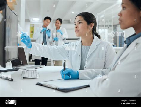 Testing Is Essential When It Comes To Our Field Two Scientists Helping One Another In The Lab