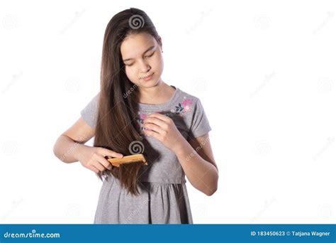 Schoolgirl With Black Hair Combs Her Hair With A Comb Stock Image Image Of Body Hair