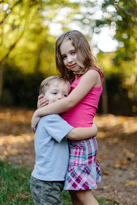Big Sister Hugging Her Little Brother By Stocksy Contributor Jakob