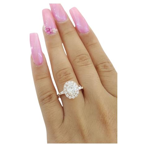 191 Carat Oval Brilliant Cut Diamond Halo Engagement Ring For Sale At