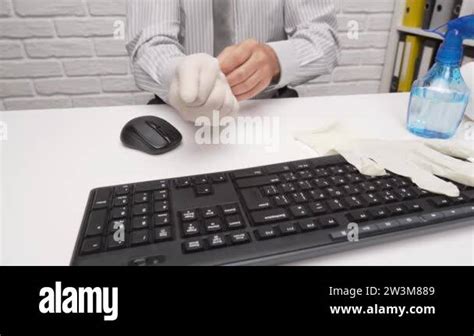 Concept Of Cleaning Or Disinfecting The Office Desk A Businessman Cleans The Workplace