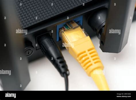 Network Cables Connected To A Router Or Modem Stock Photo Alamy