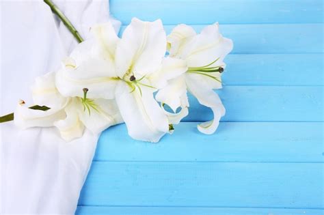 Premium Photo Beautiful Lily On Wooden Table
