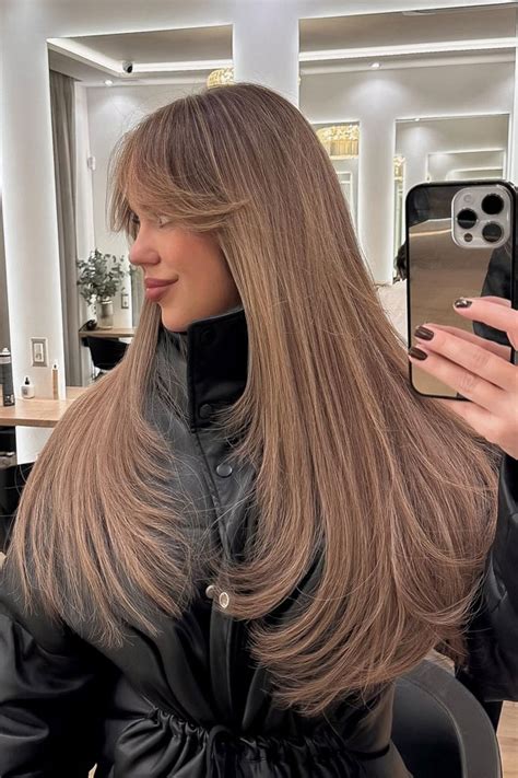 Front Layers With Soft Bangs For A Glamorous Blowout Look