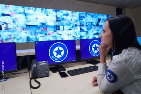 Female Operator Working In A Security Data System Control Room Stock