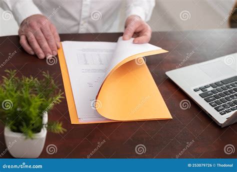 Businessman Opening Folder Stock Photo Image Of Person 253079726