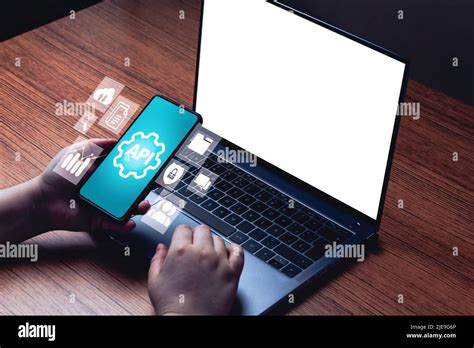 API Concept With Smartphone Interface And Blank Laptop Screen For