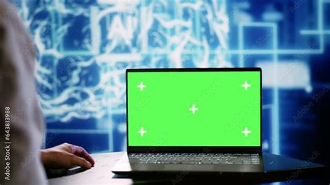 Computer Scientist Using Green Screen Laptop To Implement Artificial