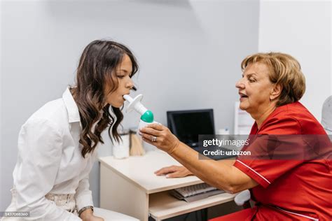 Young Woman Taking A Spirometry Test In A Medical Clinic High Res Stock