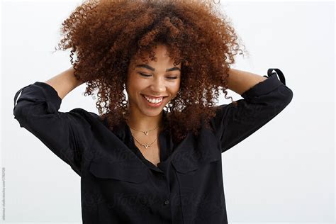 Woman Fixing Hair By Stocksy Contributor Ohlamour Studio Stocksy