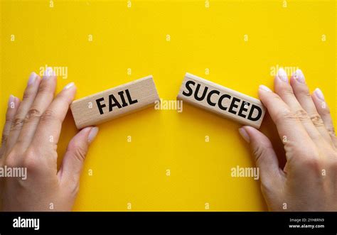 Fail Or Succeed Symbol Concept Word Fail Or Succeed On Wooden Blocks Businessman Hand