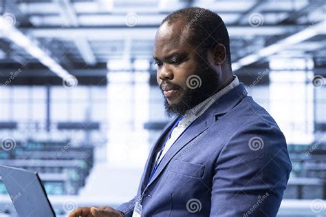 Computer Scientist In Server Room Resolving Technical Issues With