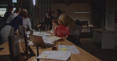 Diverse Business Team Collaborates On Project In Modern Office