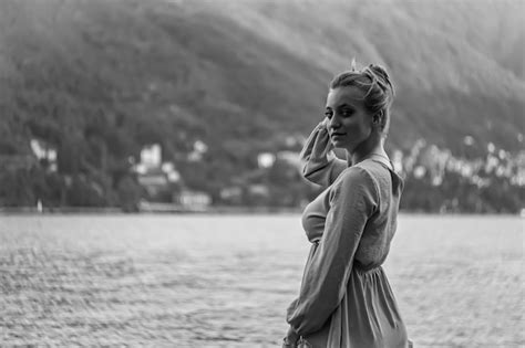 Young Woman Looking At Sea Shore Premium Photo