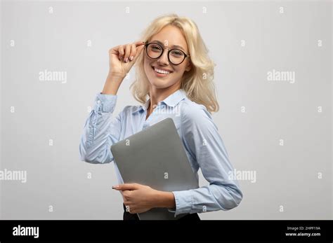 Successful Young Businesswoman In Formal Wear Holding Laptop Computer