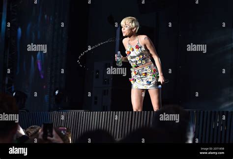 Miley Cyrus Spits Water Into The Crowd As She Performs During Capital