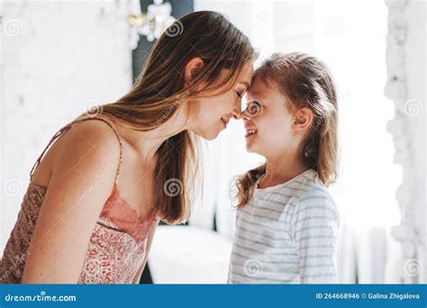 Young Mother Woman With Long Hair With Little Tween Girl Daughter In