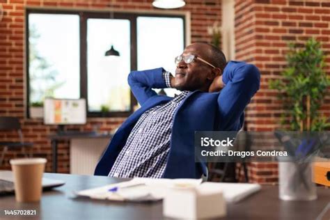 Entrepreneur Relaxing After Finishing Work Taking Break In Company
