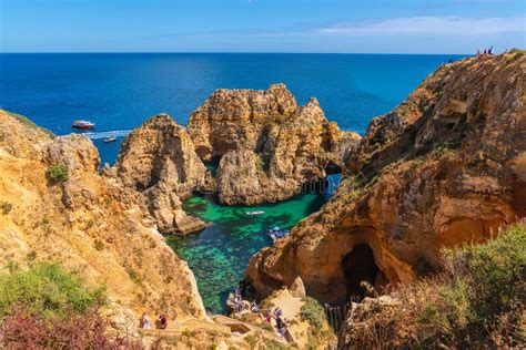 Tourists And Visitors Descend The Steps To Boats Ponta Da Piedade Coast