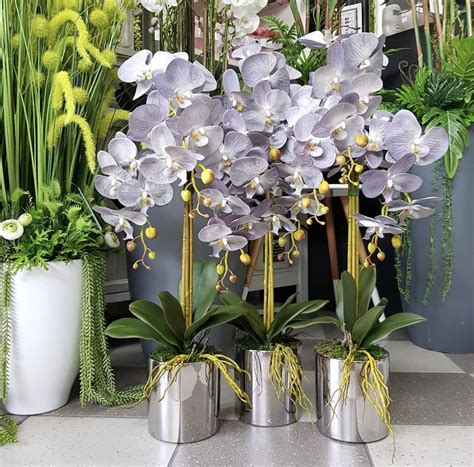 Искусственные орхидеи в вазе для интерьера 63 фото